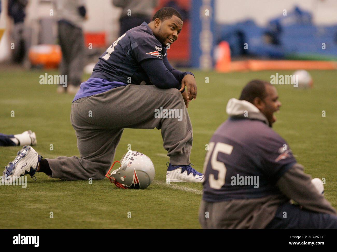 New England Patriots defensive lineman Ty Warren, left, and Patriots ...
