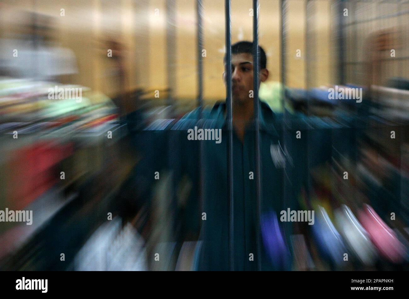 ** FILE ** Prisoner looks out of his cell in the Rusafa 5 intake prison ...