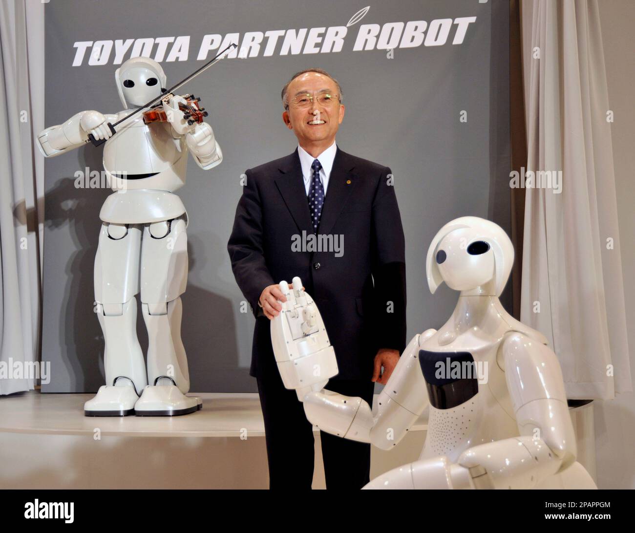 Toyota Motor Corp. President Katsuaki Watanabe smiles with the Japanese ...