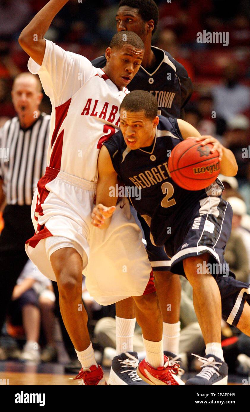 Georgetown's Jonathan Wallace (2) tries to get around Alabama defender ...