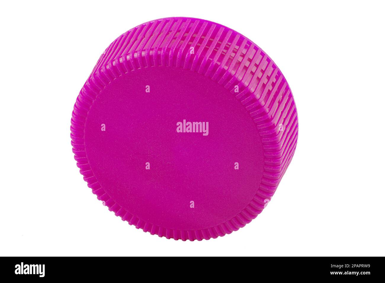 Plastic bottle caps of pink color isolated against a white background ...