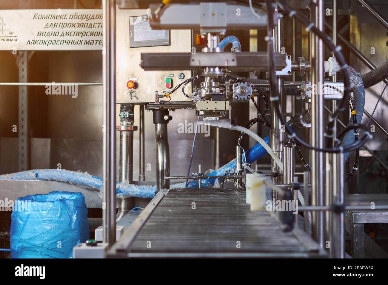 paint bottling line at the factory Stock Photo - Alamy