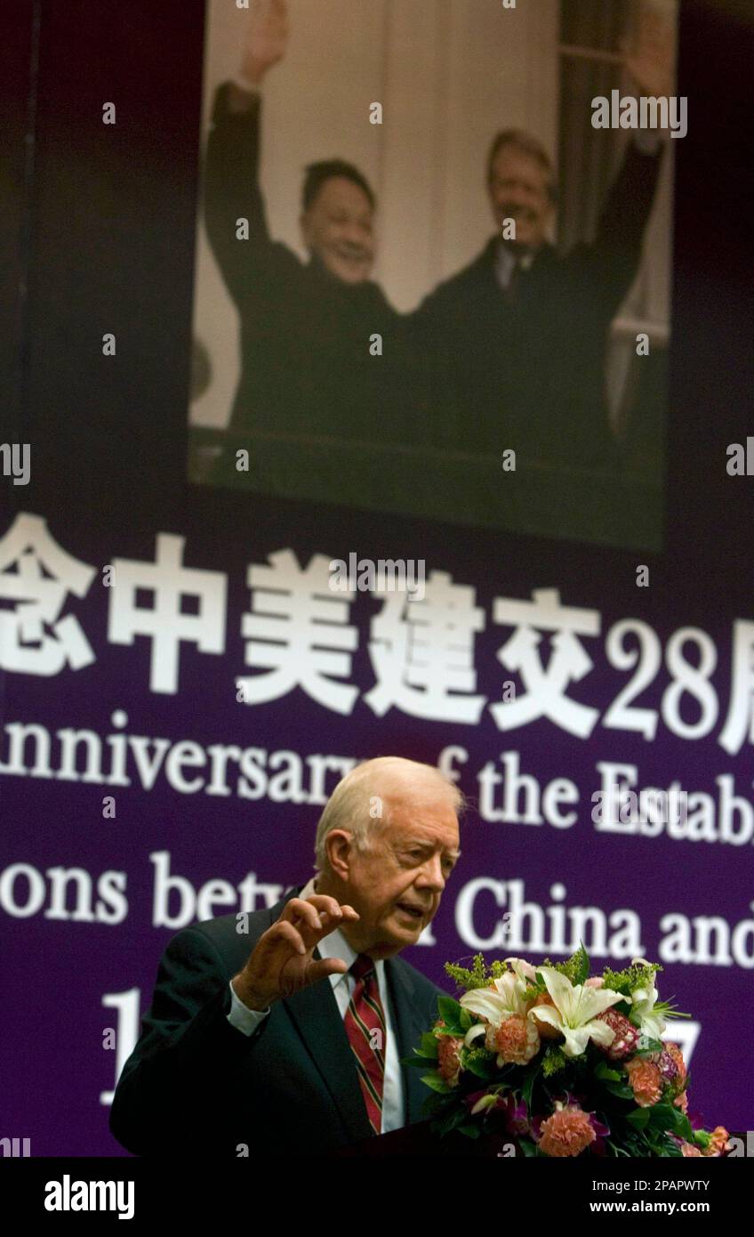 Former U.S. President Jimmy Carter speaks near a historical picture ...