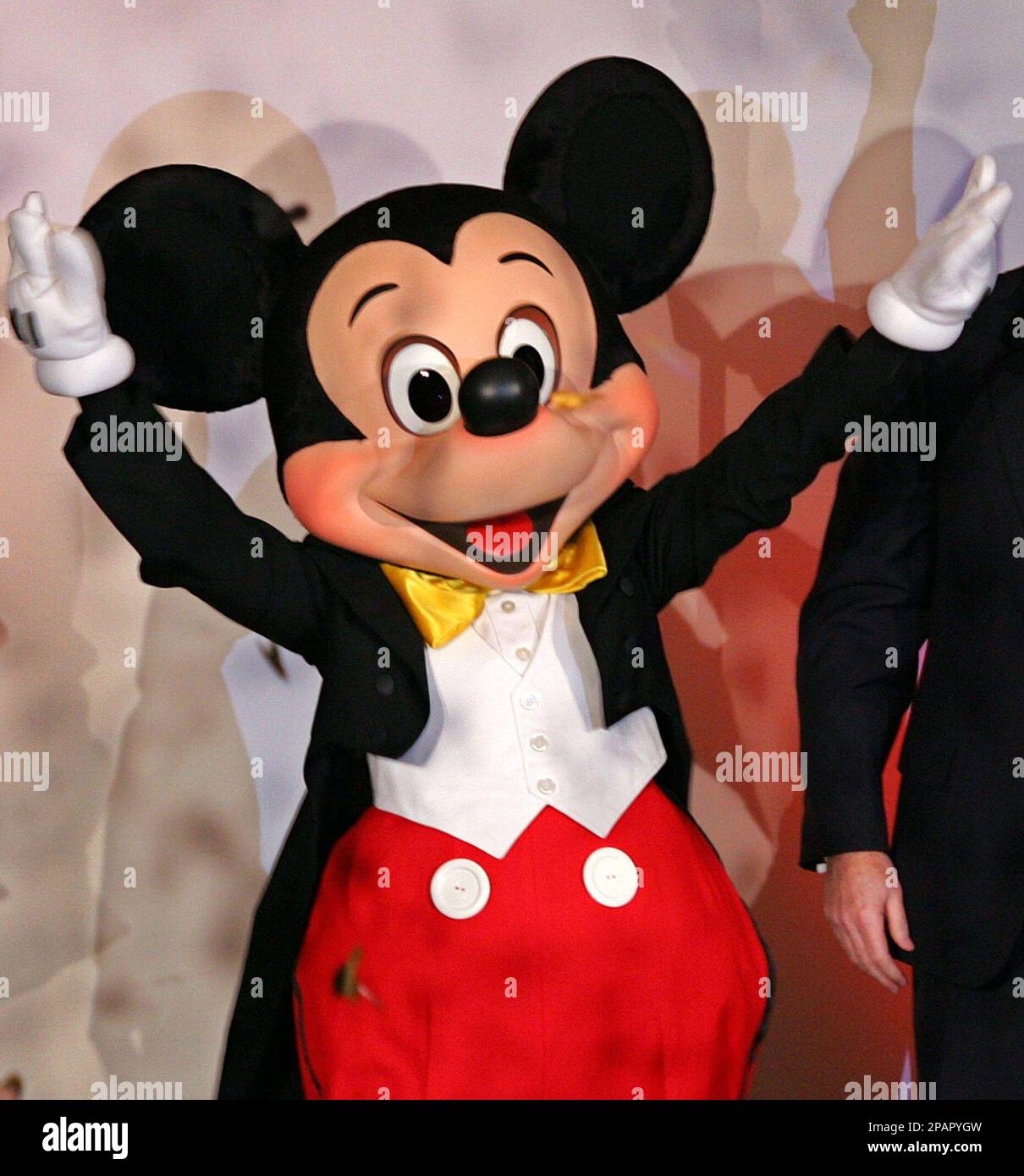 ** FILE ** Disney character Mickey Mouse celebrates after unveiling a ...