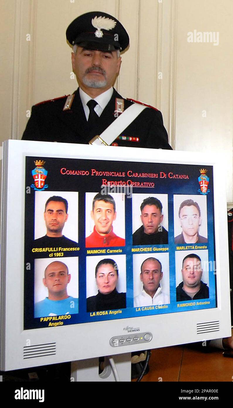 An unidentified Carabinieri paramilitary police officer stands next to ...