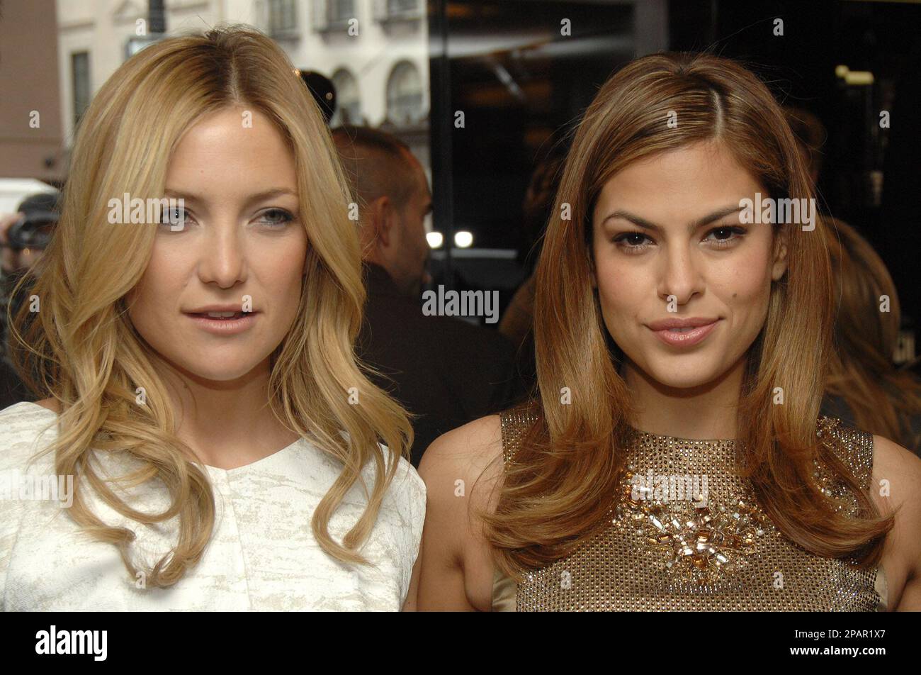 Actors Kate Hudson, left, and Eva Mendes pose for pictures at the ...