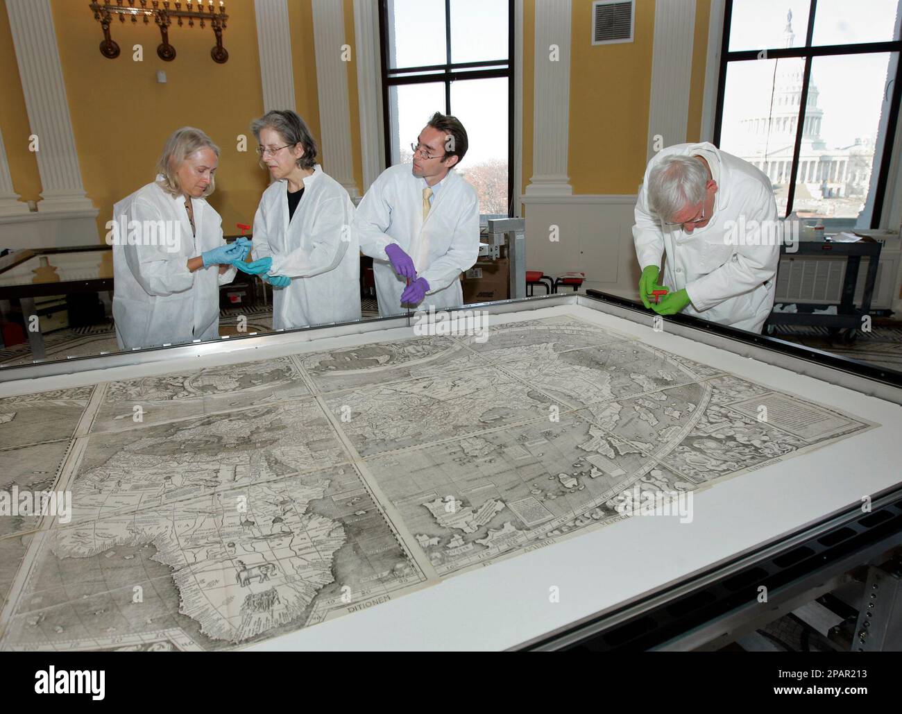 Conservators at the Library of Congress in Washington, clean and ...