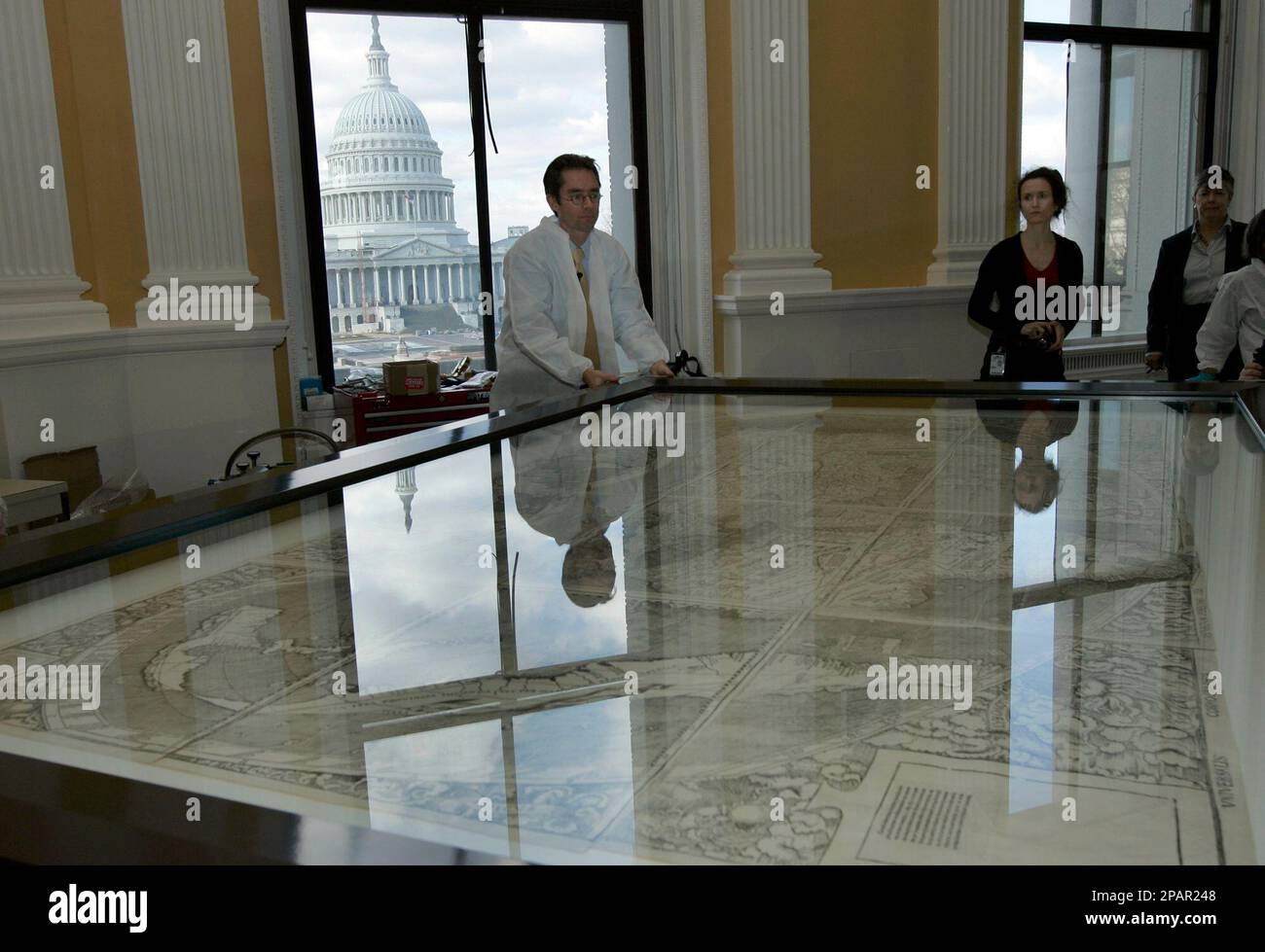 With the Capitol in the background, Elmer Eusman, assistant to the ...