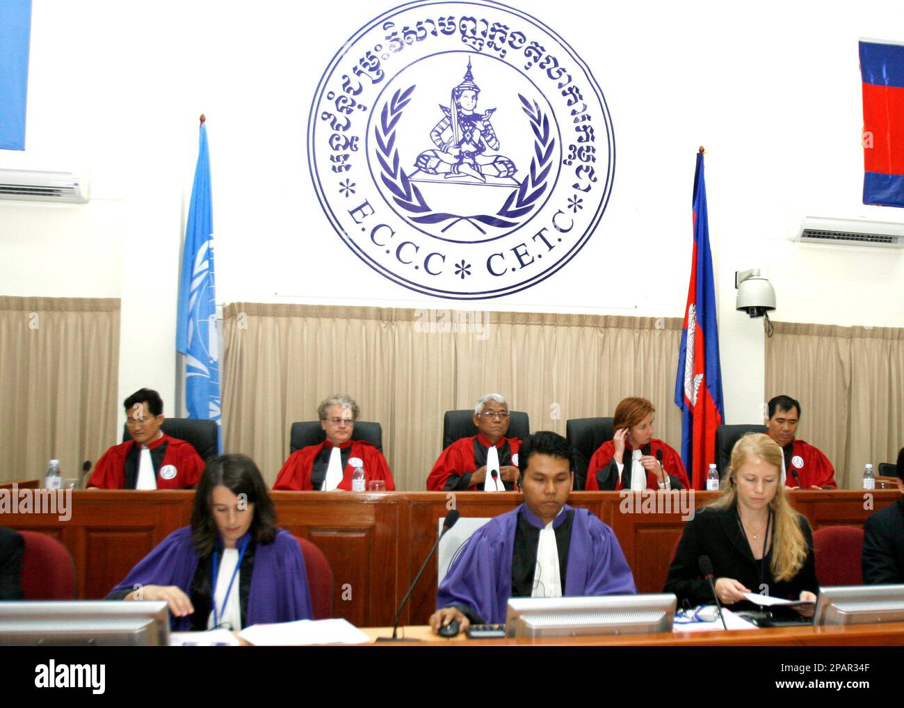 Judges and court officers of Cambodia's genocide tribunal sit in a ...