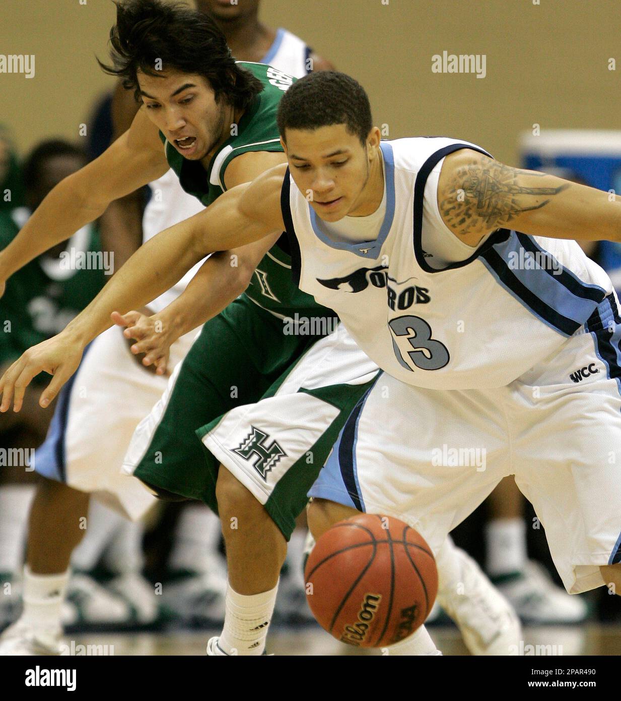 San Diego's Danny Brown, right, out-muscles Hawaii's Jared Dillinger ...