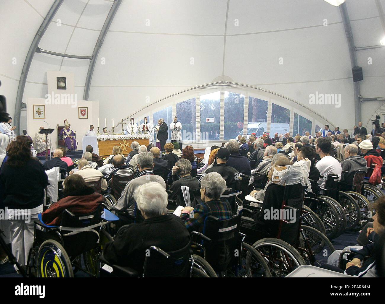 Patients in wheel chair listen on during a visit by Pope Benedict XVI ...
