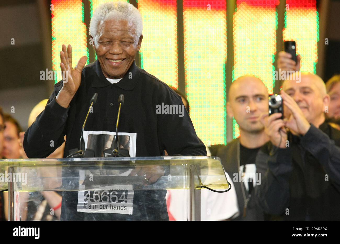 Former South African President Nelson Mandela waves at the crowd while ...