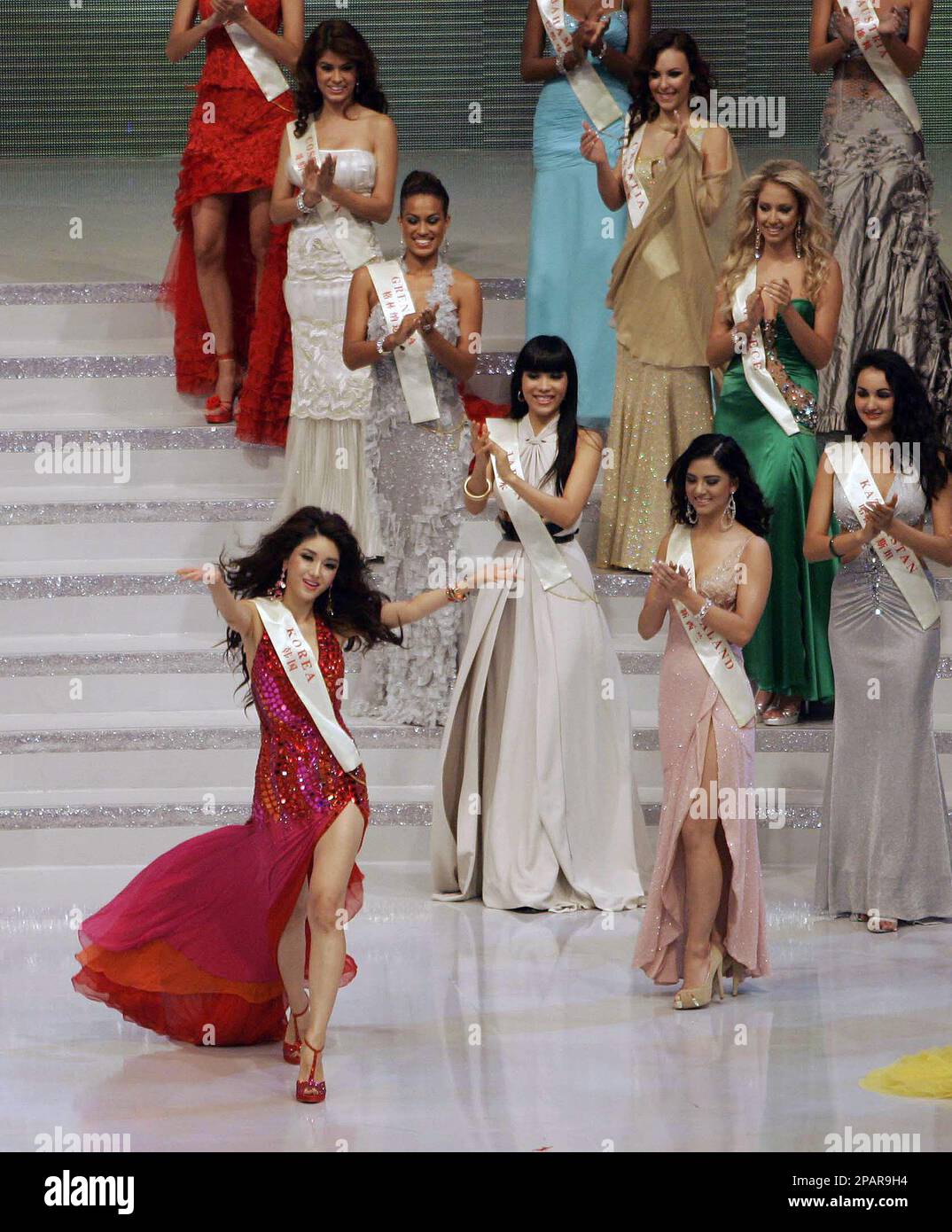 South Korea’s Cho Eun-ju, left, receives the award of the best dress ...