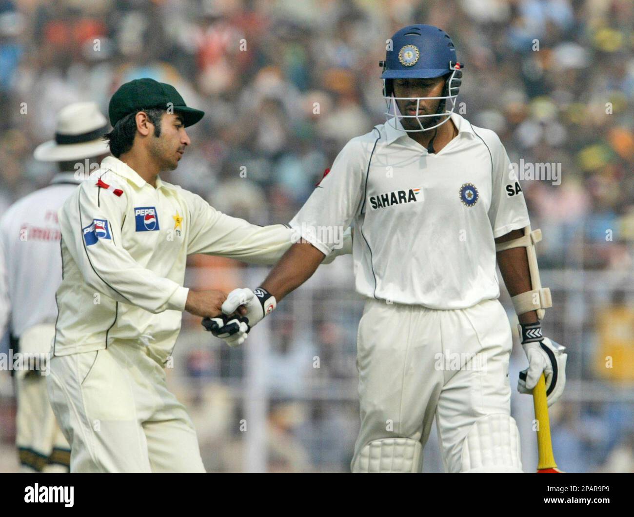 India's Wasim Jaffer, right, walks out after his dismissal as Pakistan ...