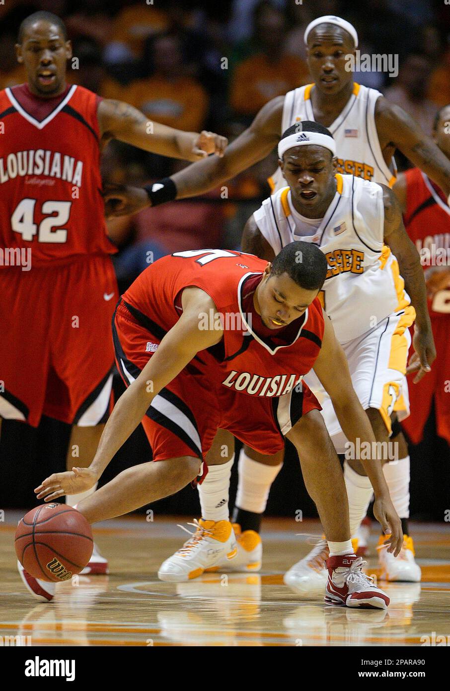 Louisiana-Lafayette's Chris Gradnigo, foreground, loses control of the ...
