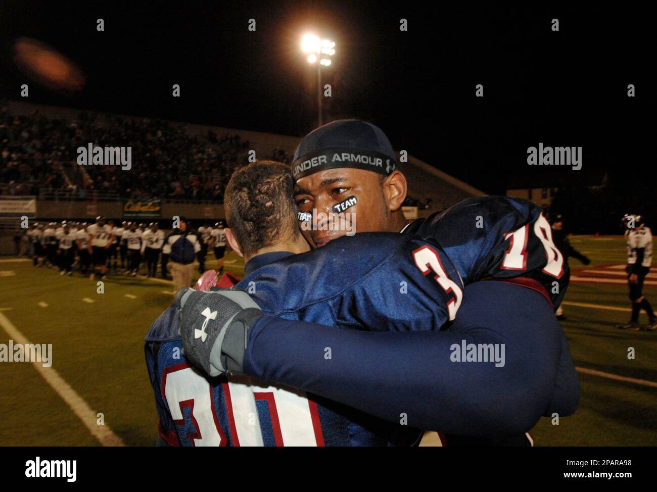 Bluefield seniors Chase Joyner (30) and Michael Miller (78) celebrate a 20-12 win against James ...