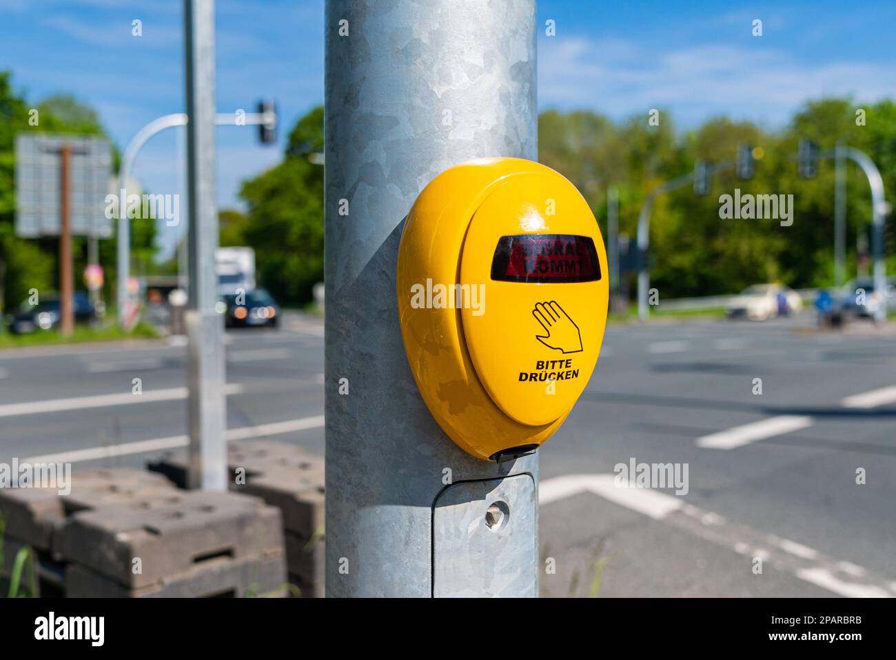 Pedestrian crossing button with blurred street with cars.. Close Up ...