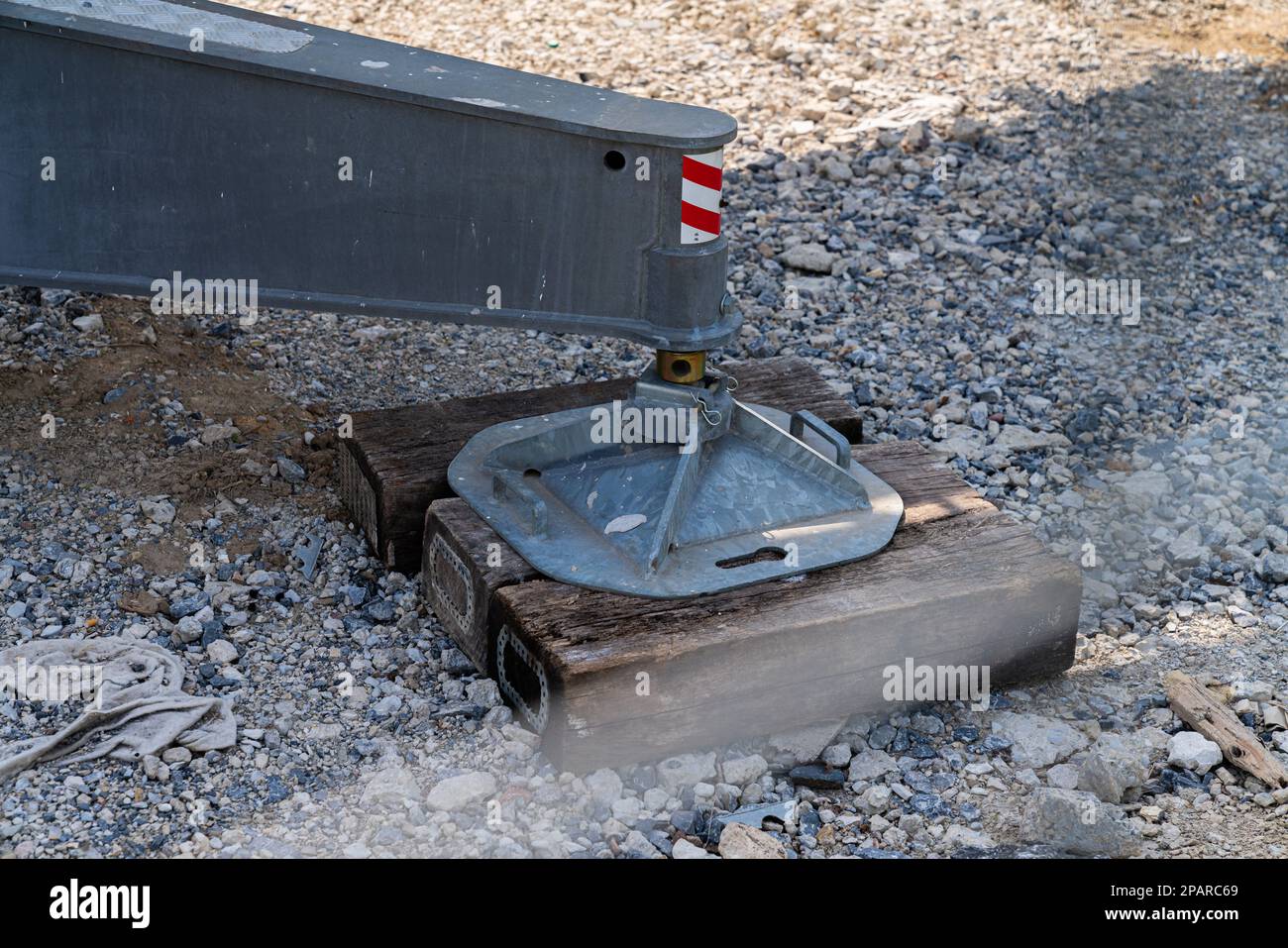 Hydraulics crane support is on gravel. Focus on the hydraulics crane ...