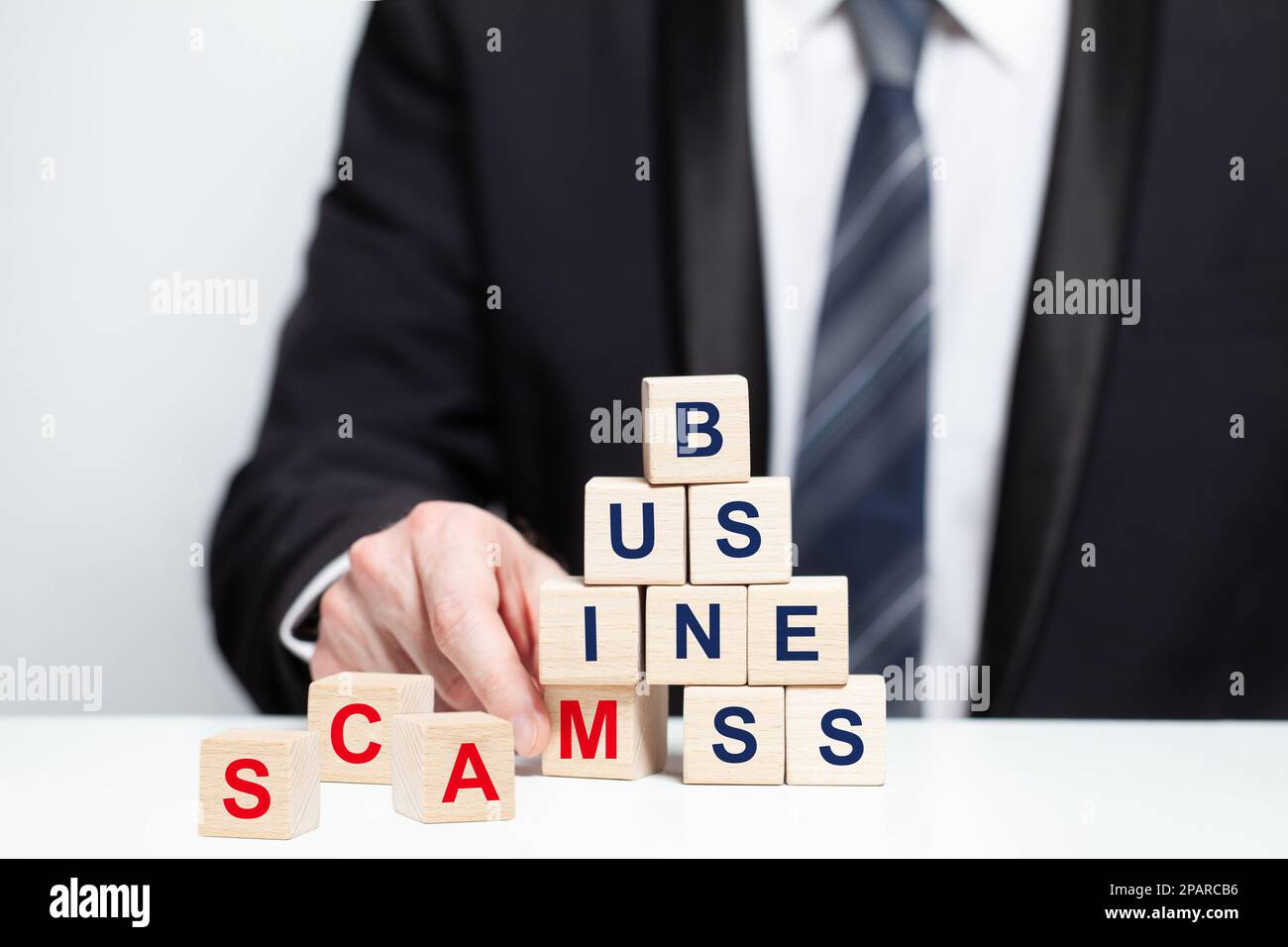 Wooden blocks with word scam, business fraud, scam and crime concept ...