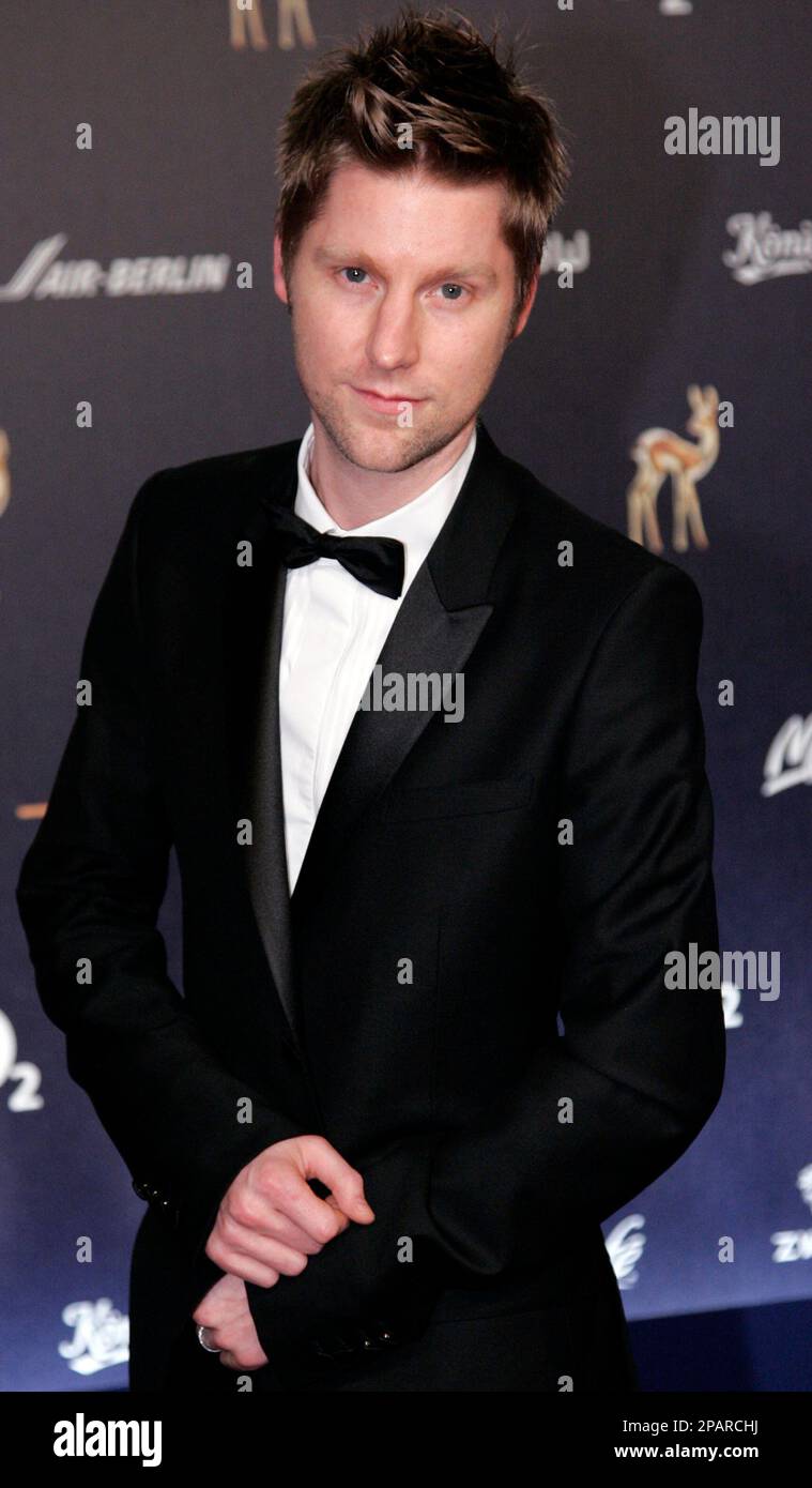 British fashion designer Christopher Bailey poses for the photographers ...