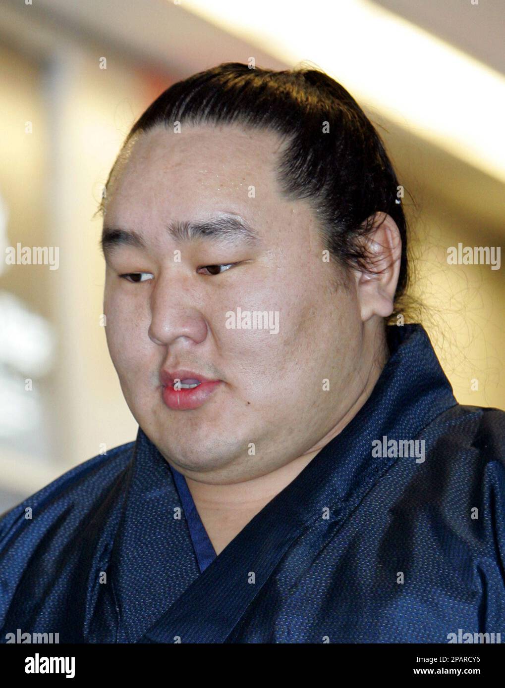 Sumo grand champion Asashoryu arrives at Tokyo International Airport in ...