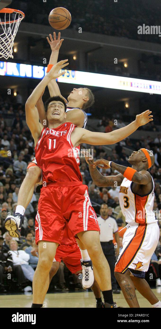 Houston Rockets center Yao Ming (11), of China, fights for a rebound ...