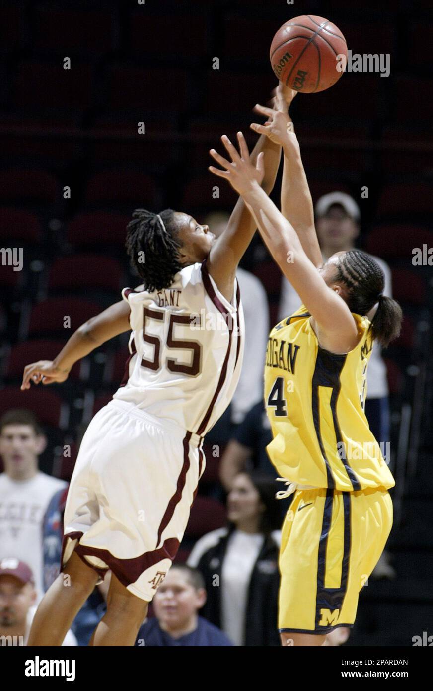 Texas A&M's Danielle Gant (55) blocks the shot of Michigan's Ta'Shia ...