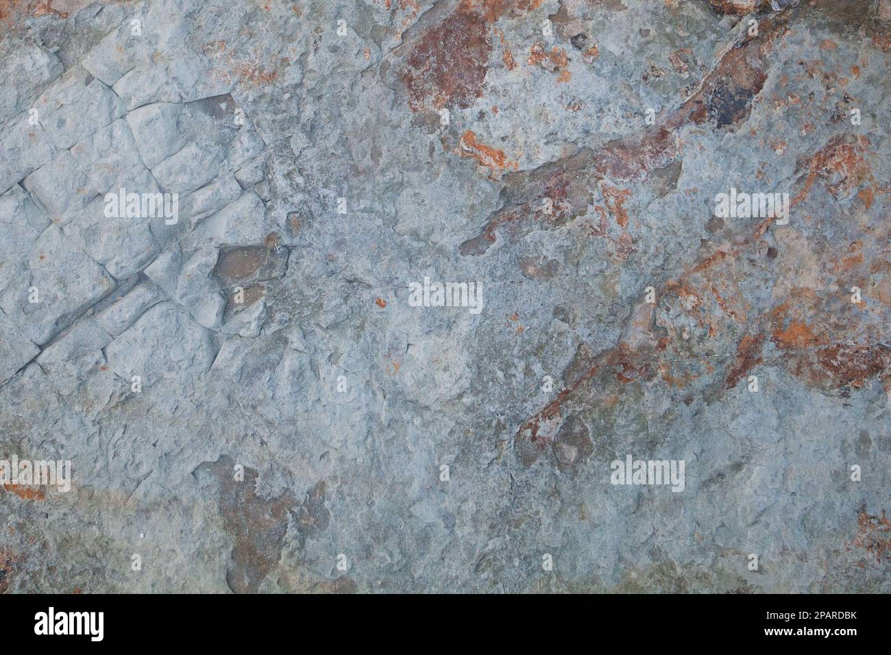 Abstract gray rocky background with red cracks Stock Photo - Alamy