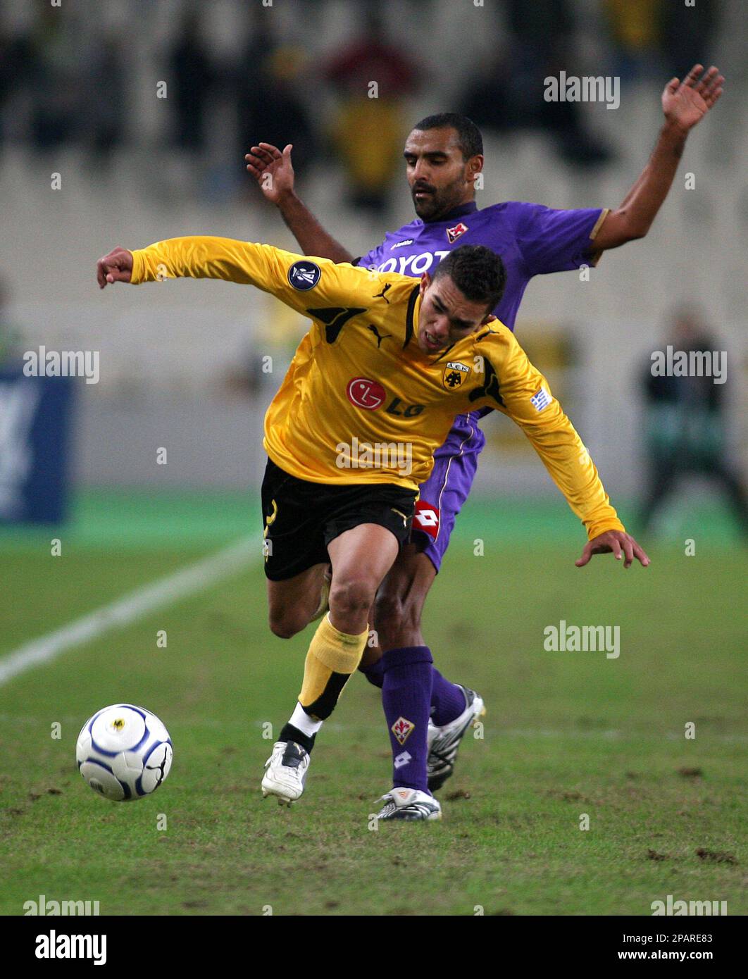 Edson Ramos Silva of AEK Athens, foreground, fights for the ball with ...