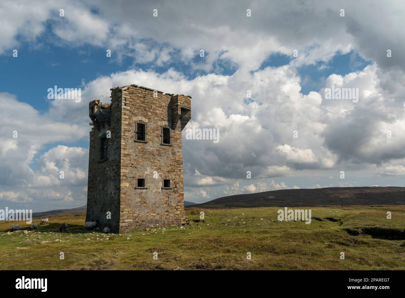 Scenic view of the Glencolumbkille signal tower under a dramatic cloudy ...