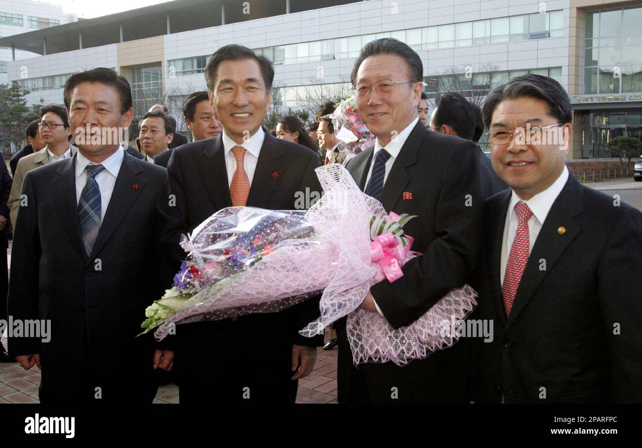North Korean adviser Kim Yang Gon, second from right, poses with South ...