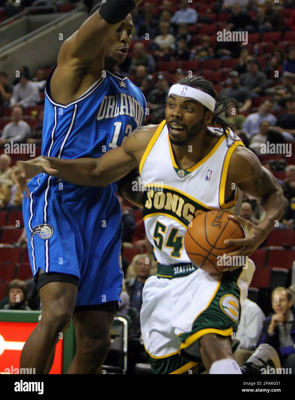 Orlando Magic Dwight Howard, left, pressures Seattle SuperSonics' Chris ...