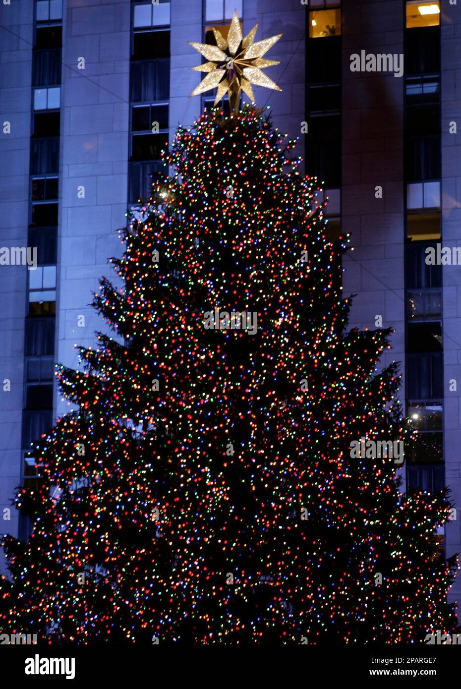 The Rockefeller Center Christmas tree is lit in New York, Wednesday ...