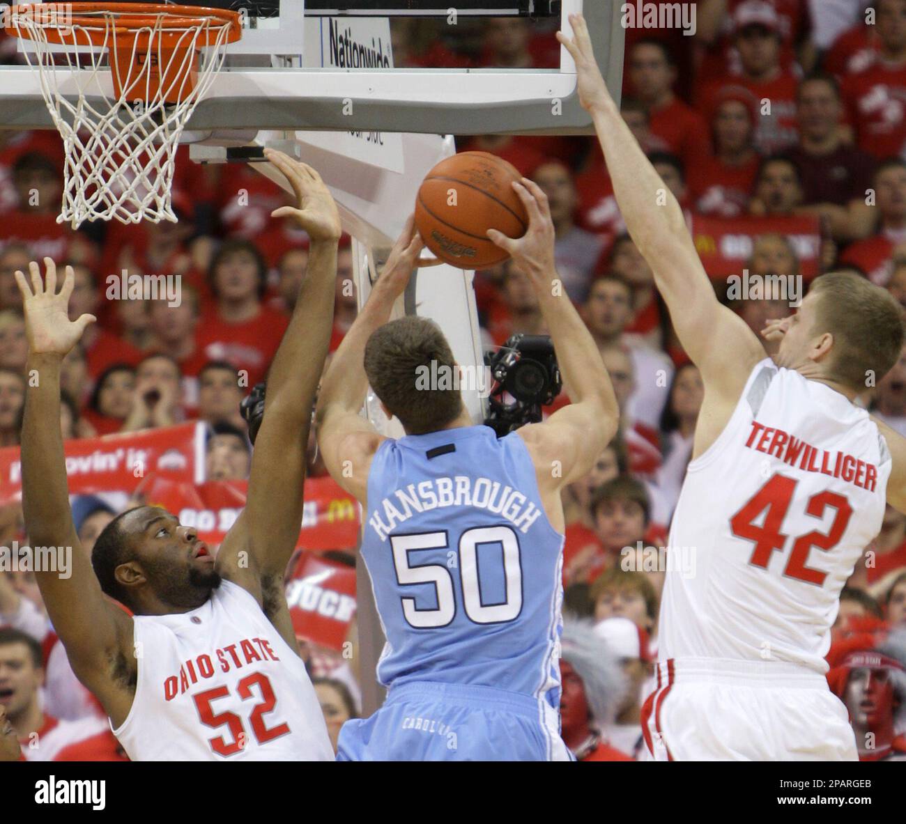 North Carolina's Tyler Hansbrough, center, takes a shot between Ohio ...