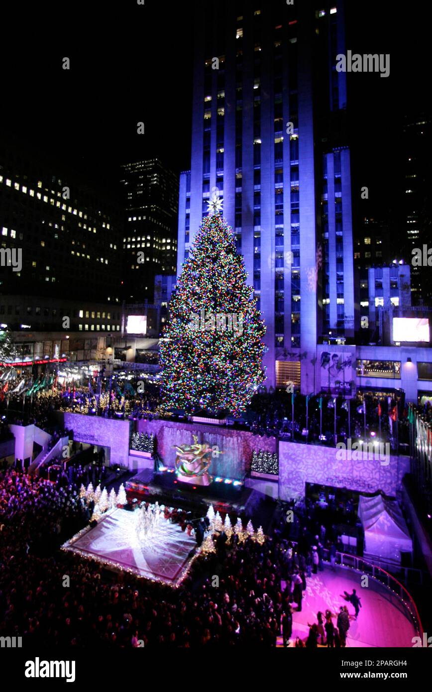 The Rockefeller Center Christmas tree is lit in New York, Wednesday ...