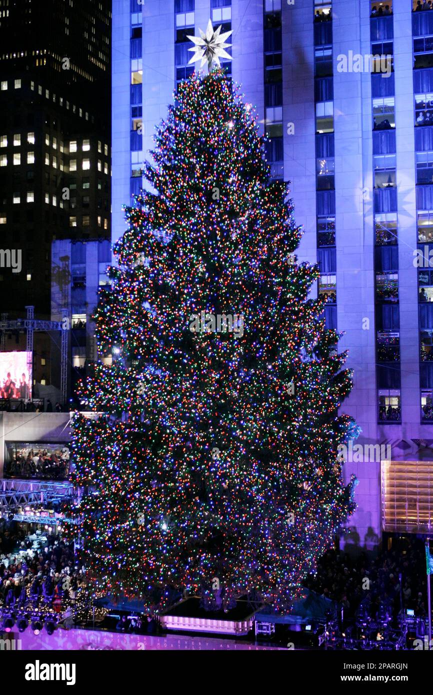 The Rockefeller Center Christmas tree is lit in New York, Wednesday ...