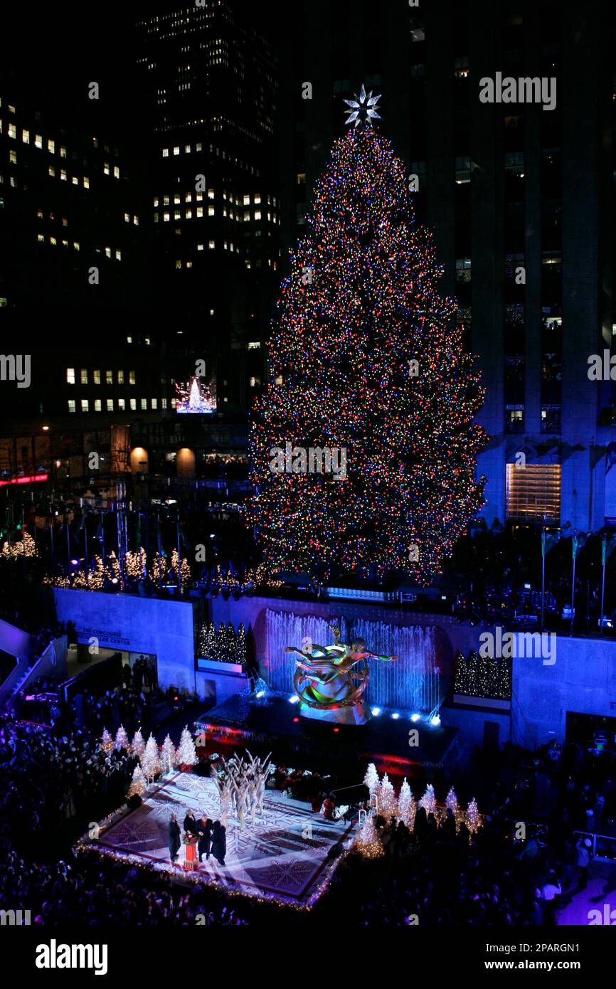 The Rockefeller Center Christmas tree is lit in New York, Wednesday ...