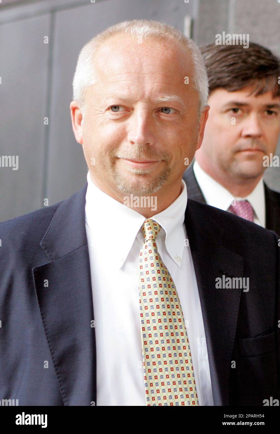 Former British banker Giles Darby smiles as he arrives at the federal ...