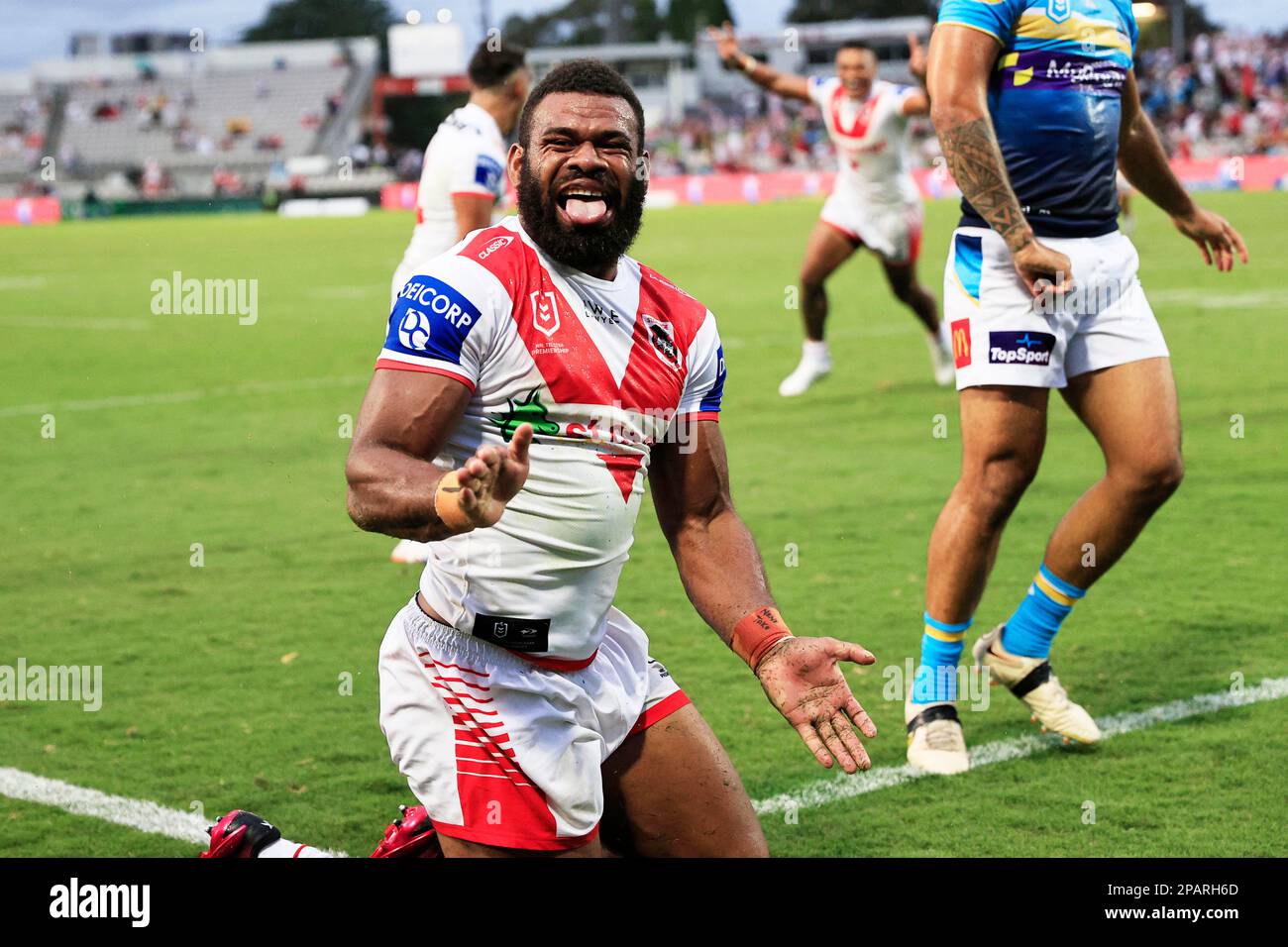 Mikaele Ravalawa of the Dragons celebrates a try during the NRL Round 2 ...