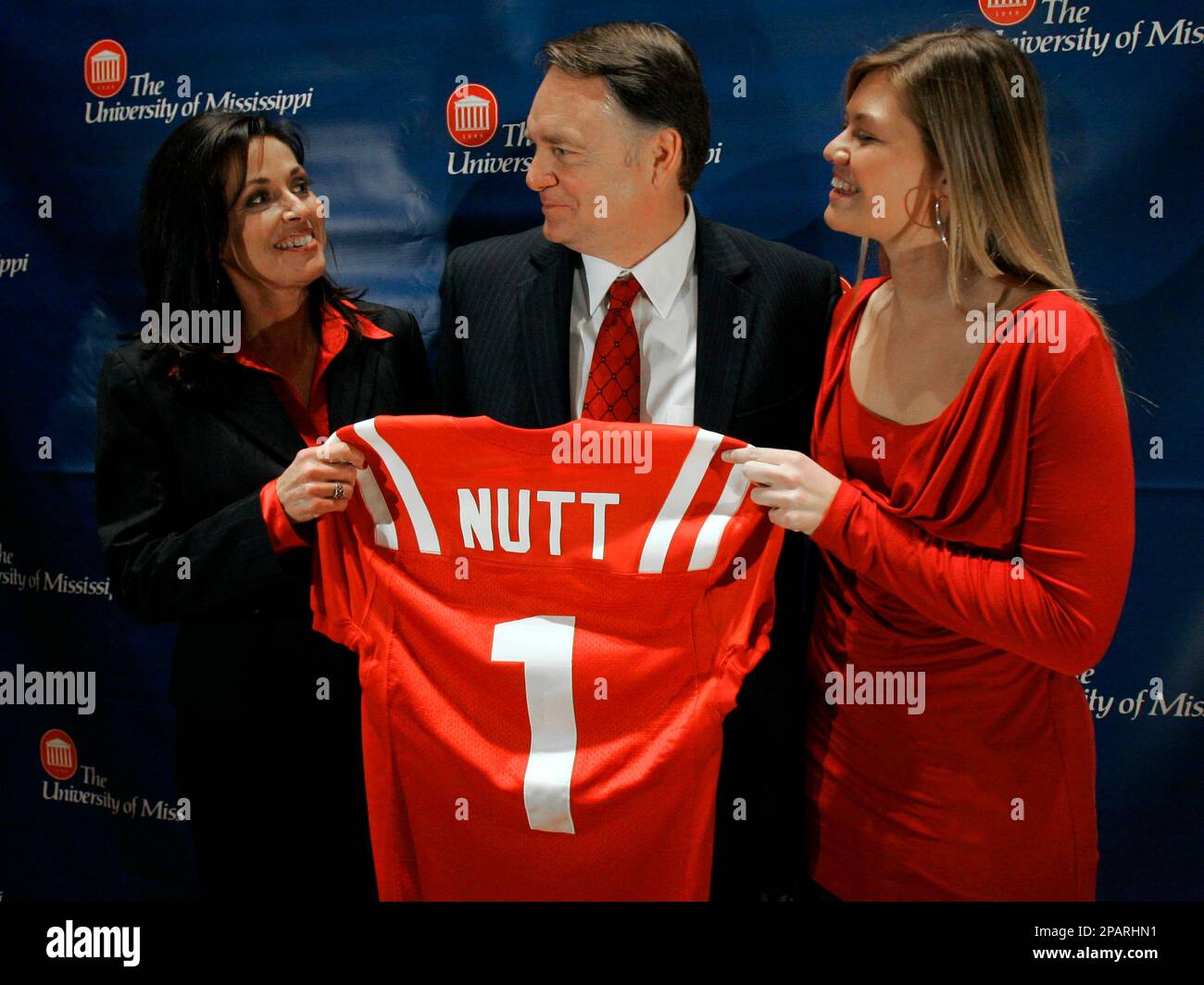 New Mississippi football coach Houston Nutt, center, confers with his ...