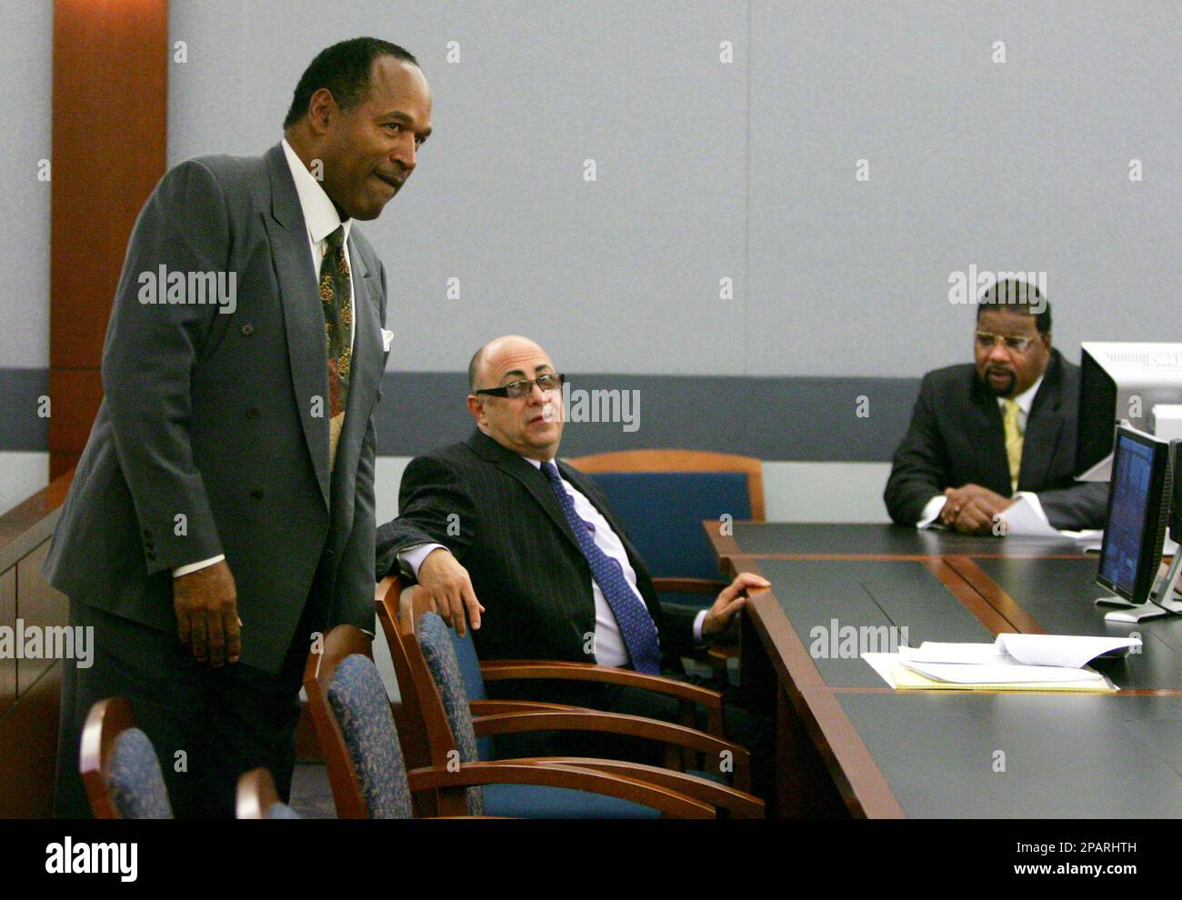 O.J. Simpson, left, two co-defendants Charles Ehrlich, background center, and Clarence Stewart ...