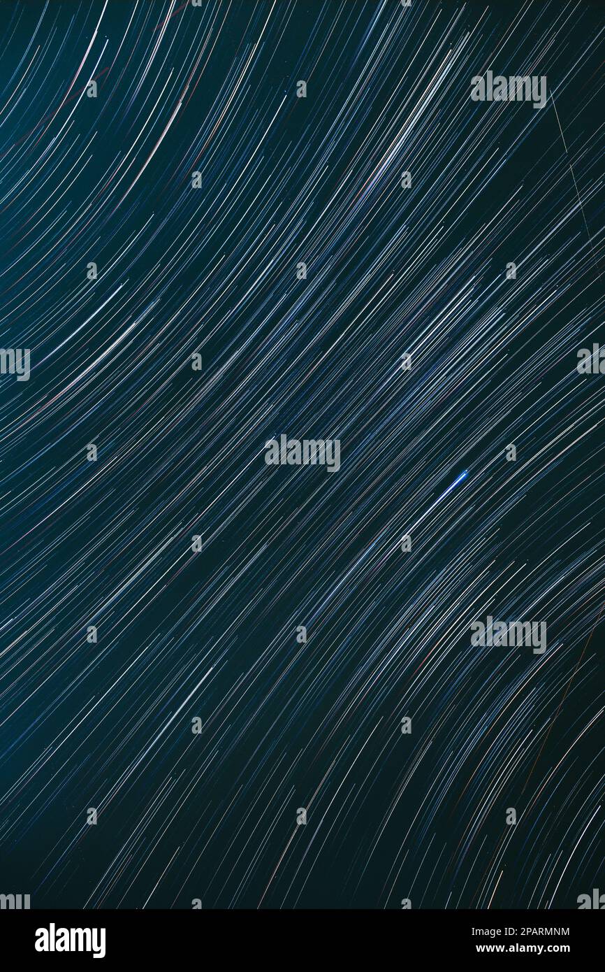 Meteors Trace On Night Dark Blue Sky Background. Spin Of Unusual ...