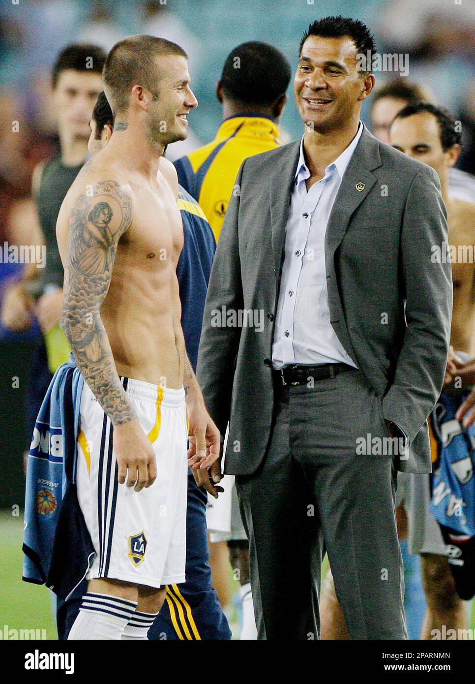 England's LA Galaxy soccer star David Beckham, left, chats with his ...