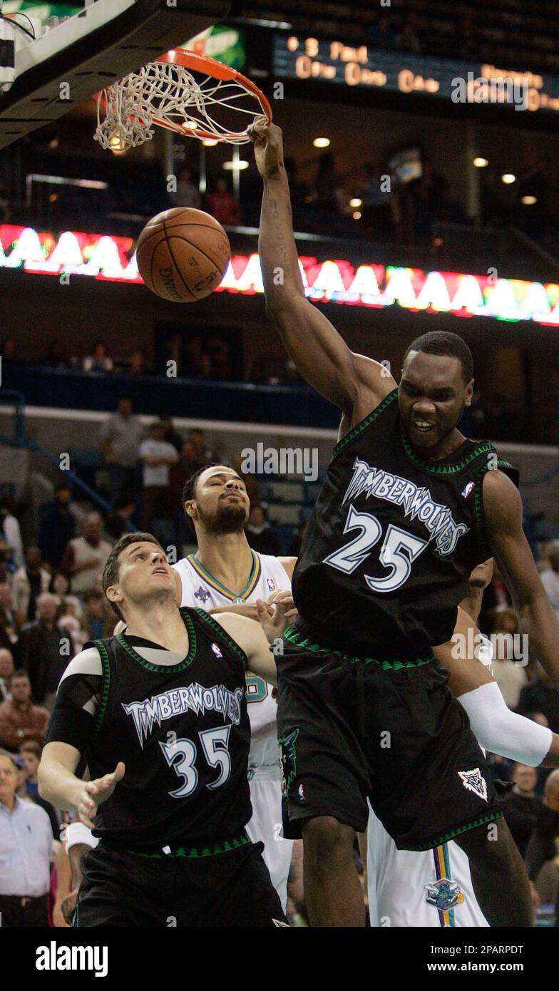 Minnesota Timberwolves Al Jefferson (25) dunks the ball as teammate ...