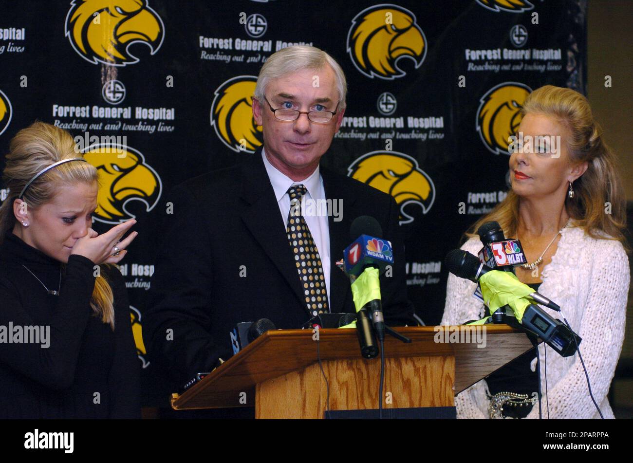 Southern Mississippi football coach Jeff Bower, center, flanked by his ...
