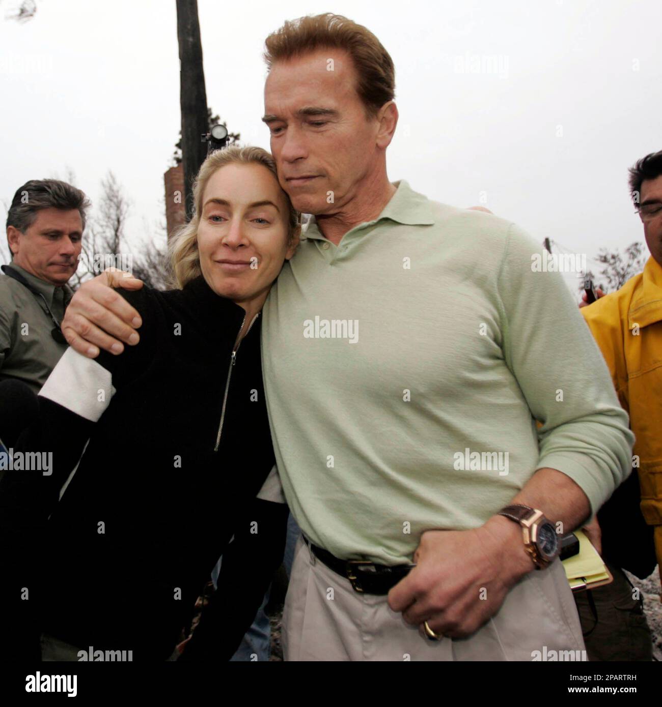 California Gov. Arnold Schwarzenegger, right, hugs Jennifer Grossman ...