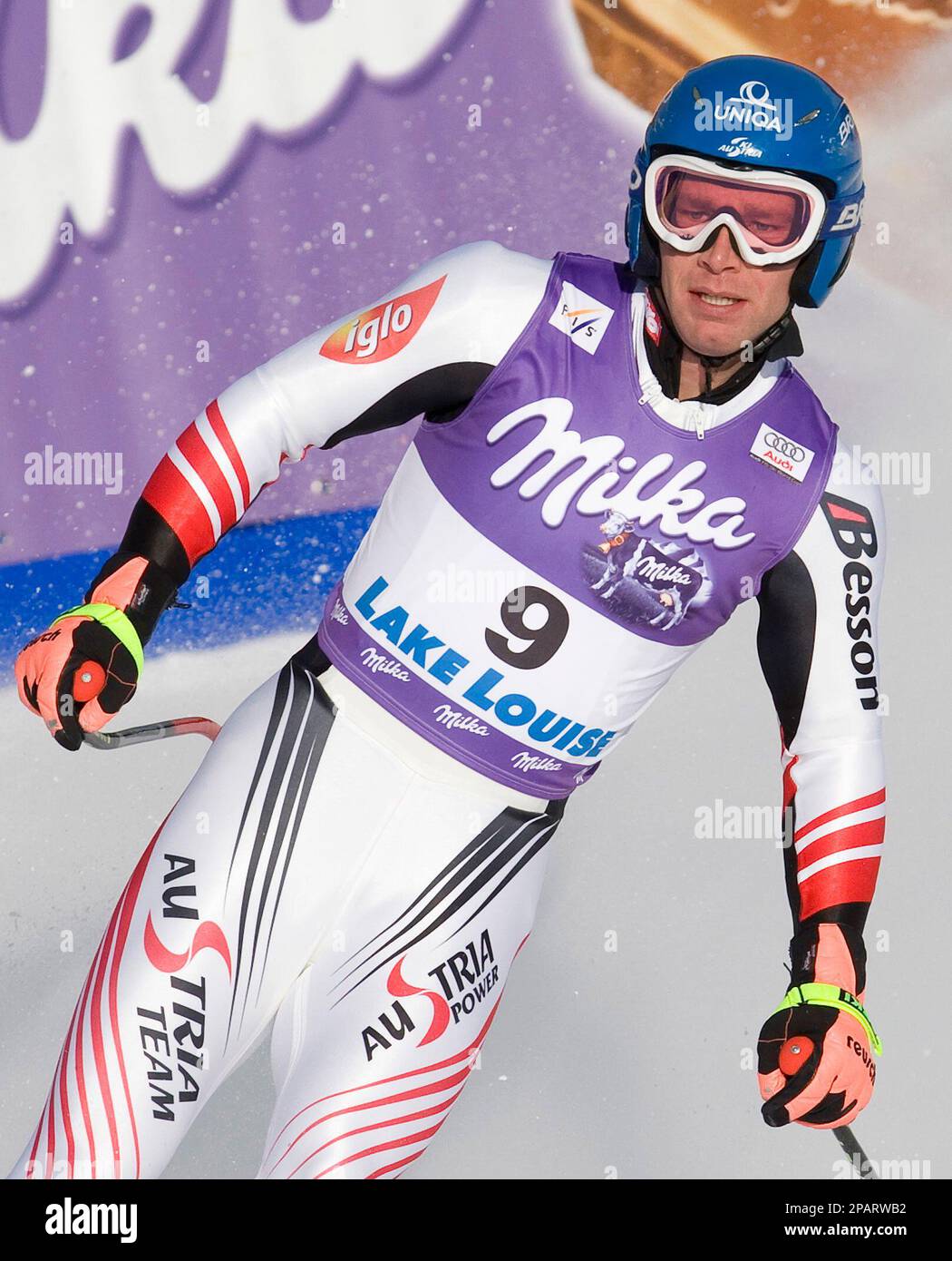 Second place finisher Benjamin Raich, of Austria, crosses the finish ...