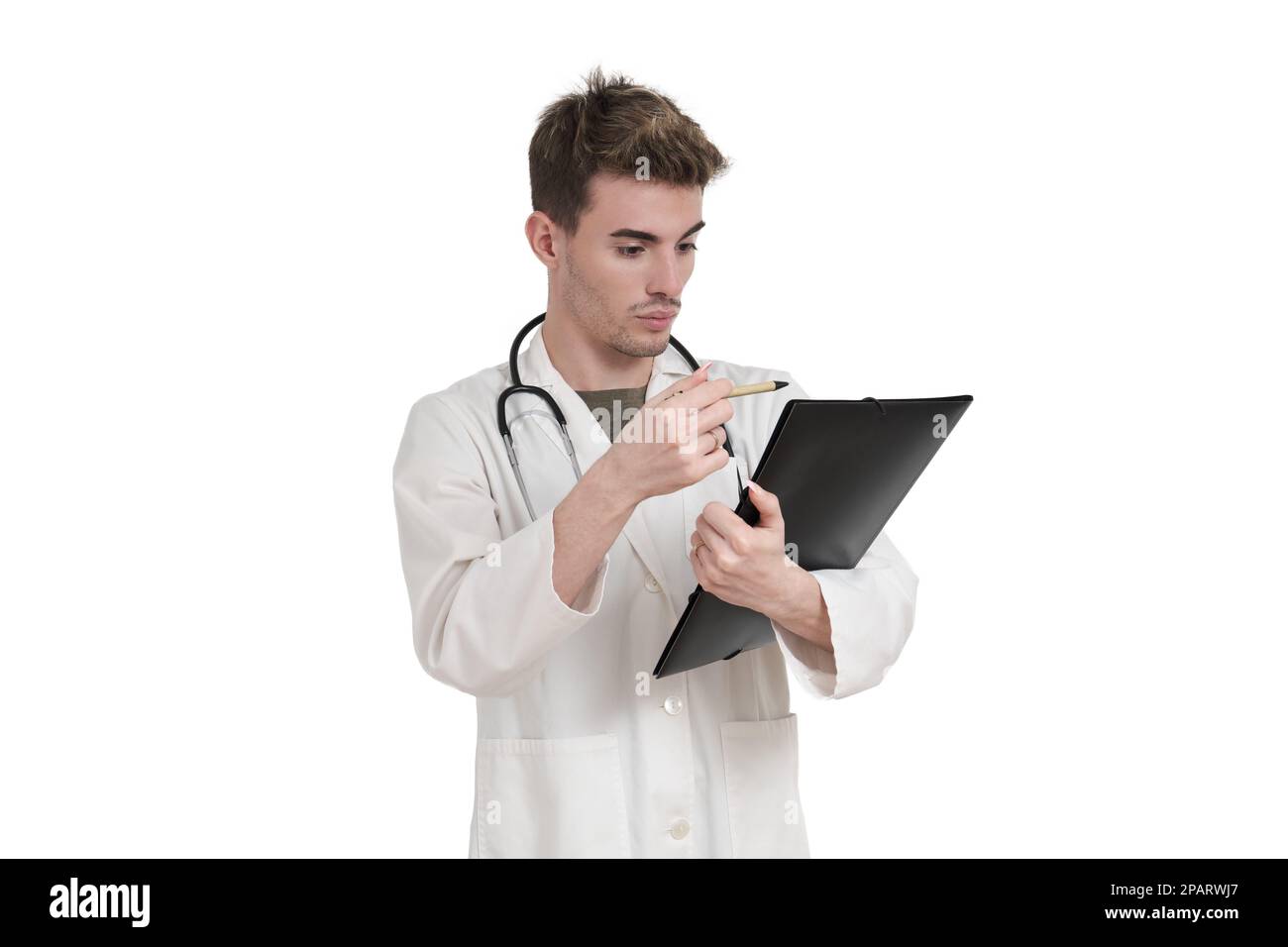 Young caucasian male doctor reading a medical report, isolated Stock ...