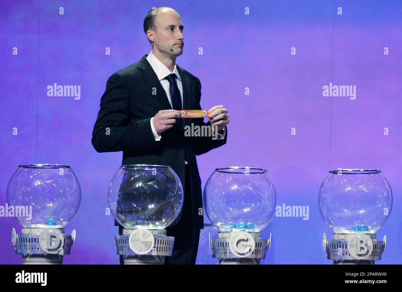 Kasey Keller of the United States holds up the name of Mexico during ...