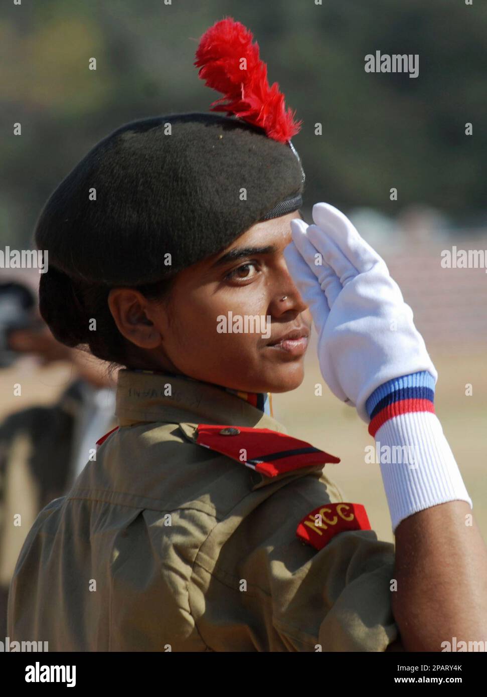A cadet of the National Cadet Corps (NCC) salutes during a parade to ...